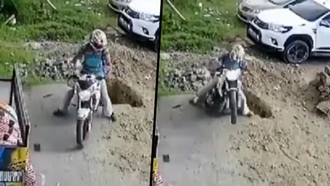 Man falls into pit while reversing a bike; video goes viral | Asianet ...