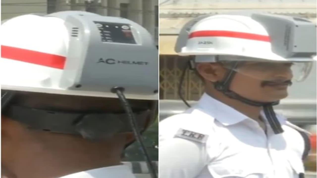 Vadodara Traffic Police wears AC helmet designed by IIM student to beat ...