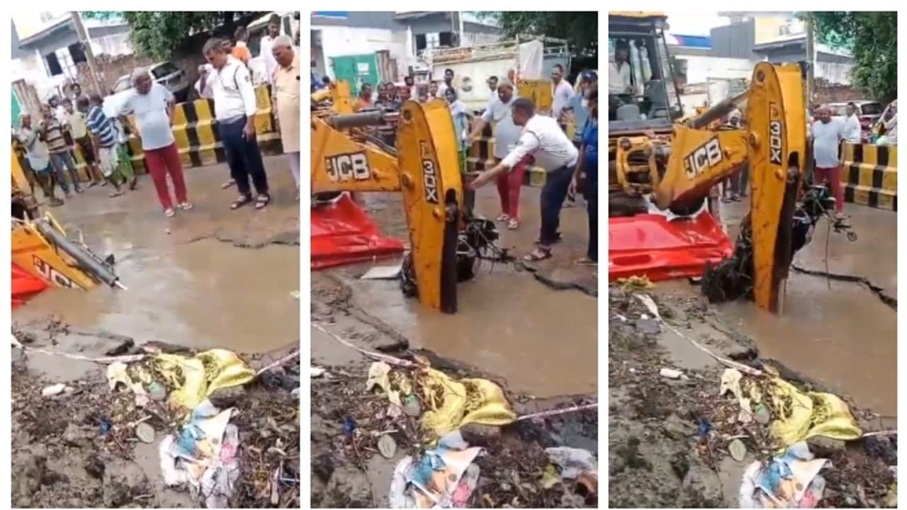 Bike falling into pothole on road being lifted with JCB video viral ...