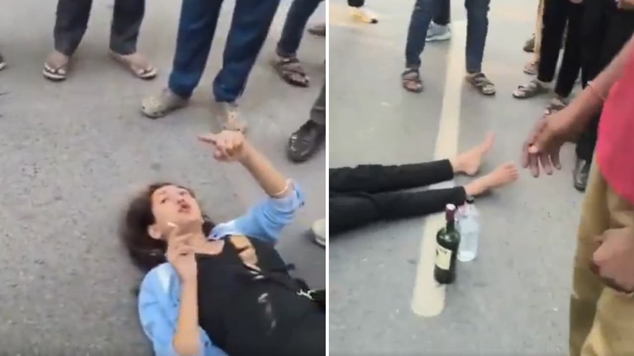 Viral Video: Woman Lies In Middle Of Road, Smokes Cigarette, Refuses To ...