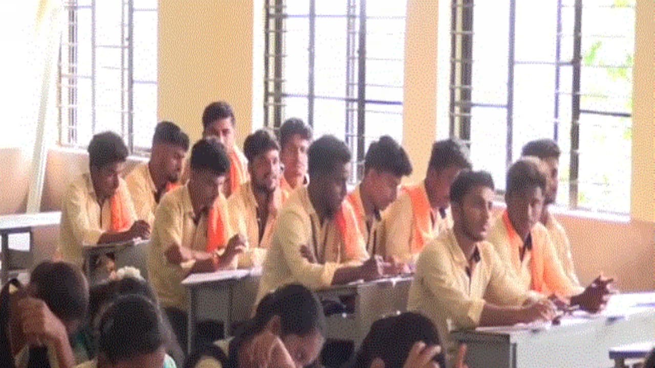 Karnataka college sees fresh Hijab row as students wear saffron shawls ...